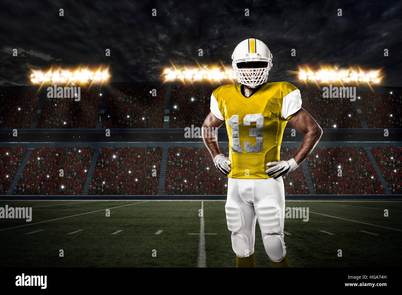Football Player with a yellow uniform on a stadium Stock Photo - Alamy