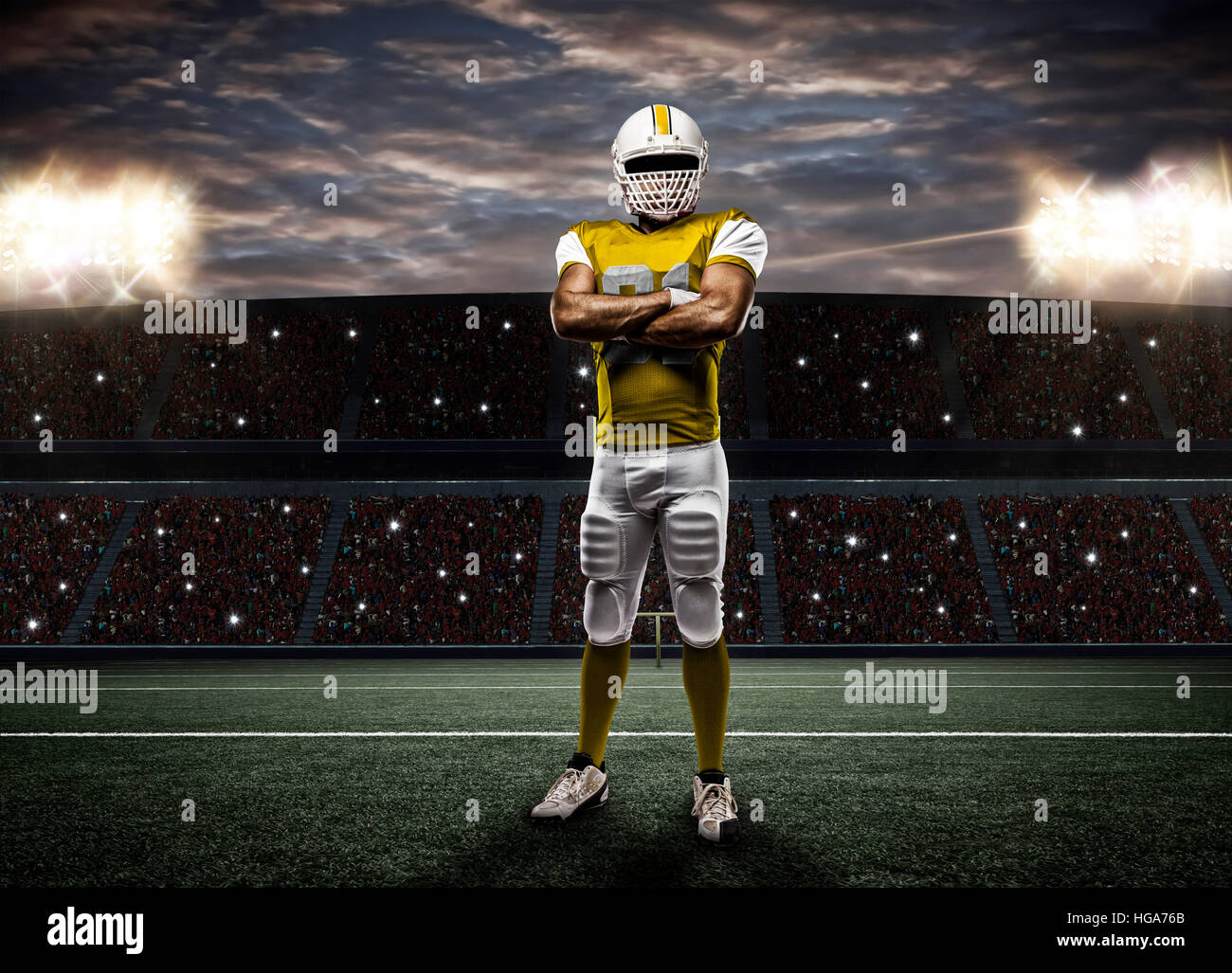 Football Player with a yellow uniform on a stadium Stock Photo - Alamy