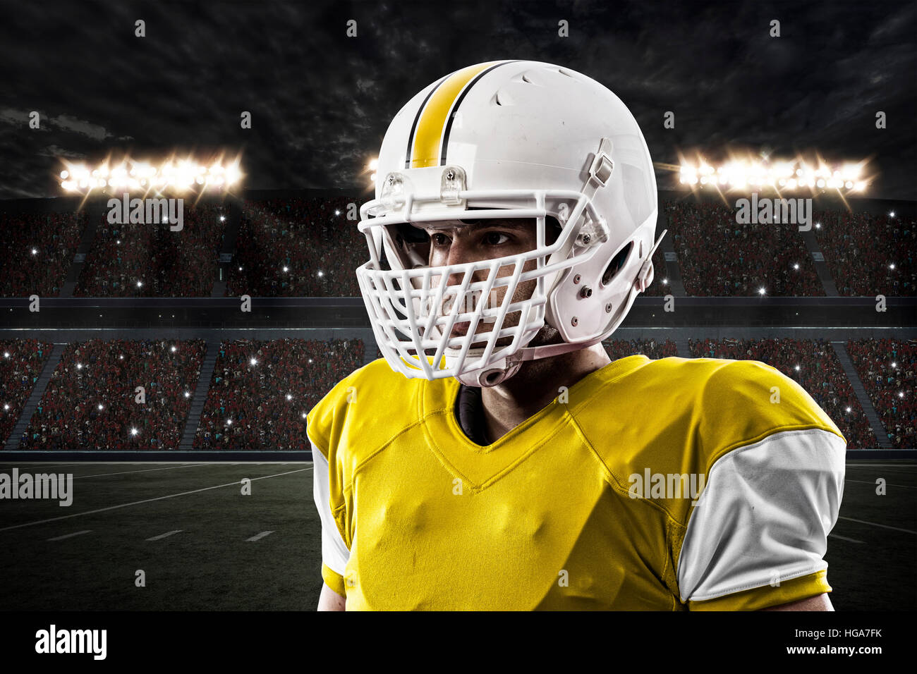 Close up of a Football yellow with a white uniform on a stadium Stock ...