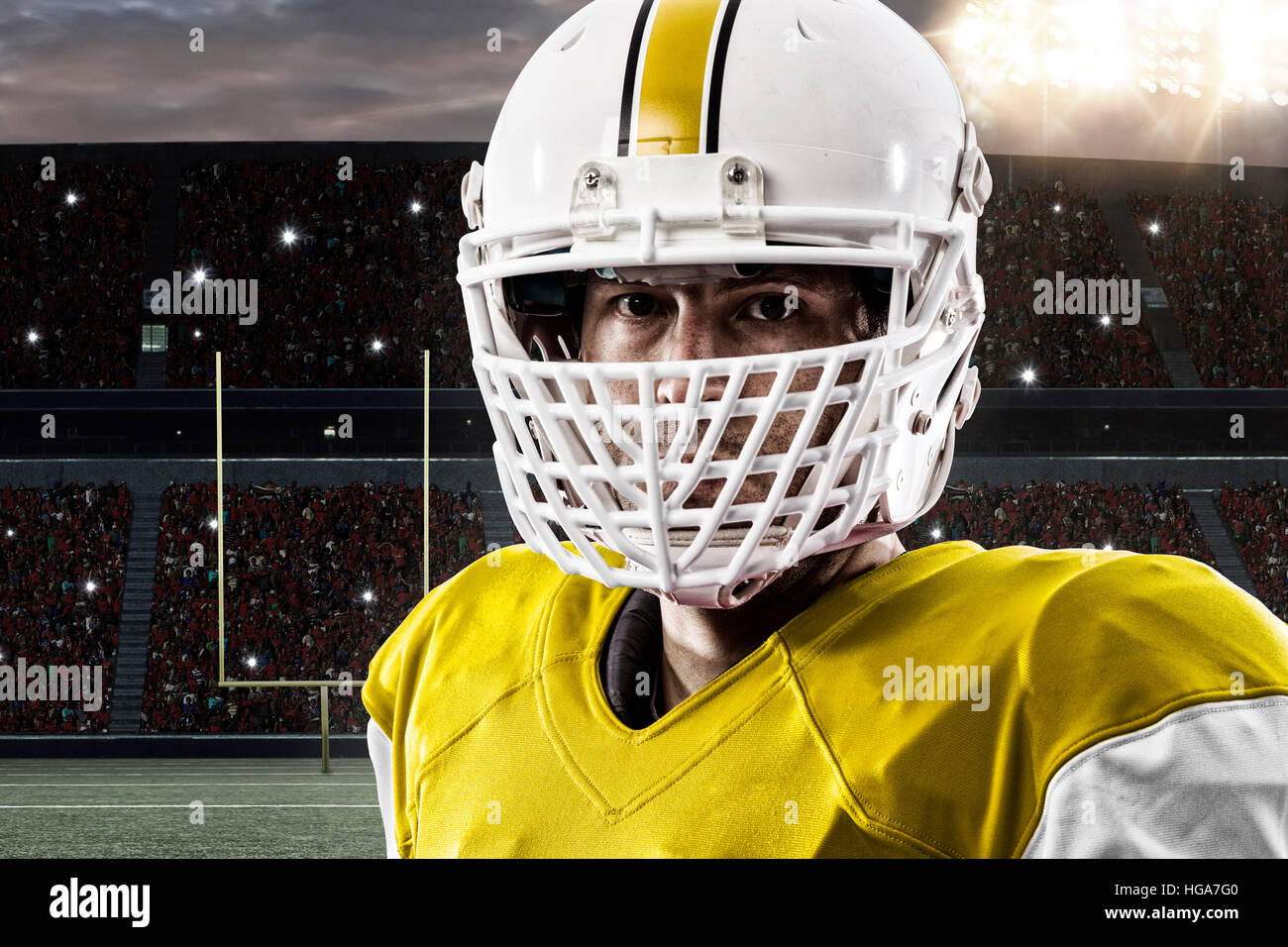 Close up of a Football yellow with a white uniform on a stadium Stock ...