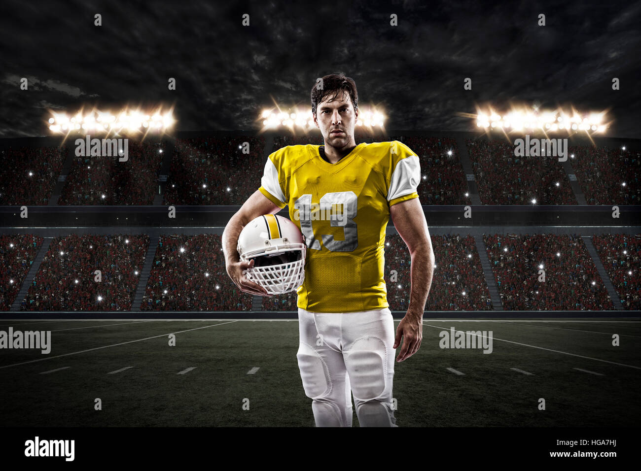 Football Player with a yellow uniform on a stadium Stock Photo - Alamy