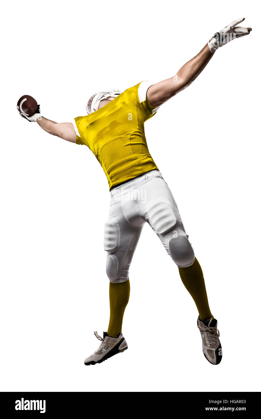 Football Player with a yellow uniform making a catching on a white ...