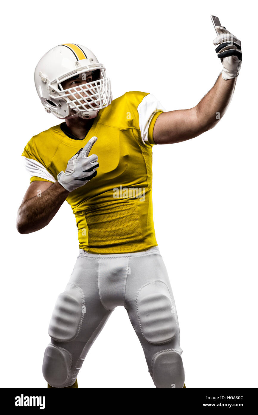 Football Player with a yellow uniform making a selfie on a white ...