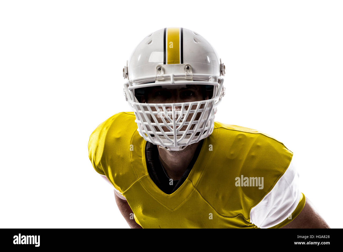 Close up of a Football Player with a yellow uniform on a white ...