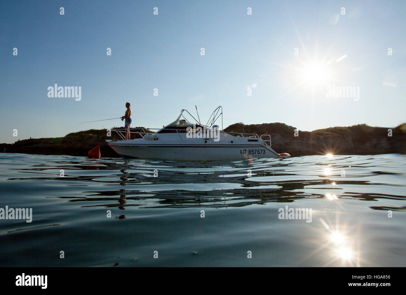 Person Fly Fishing Standing On Boat In The Ocean Stock Photo - Alamy