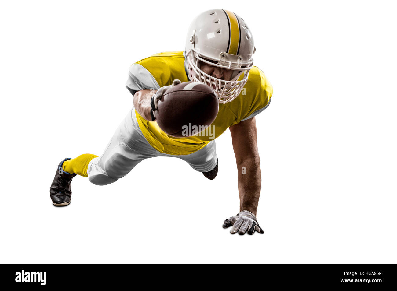 Football Player with a yellow uniform scoring on a white background ...