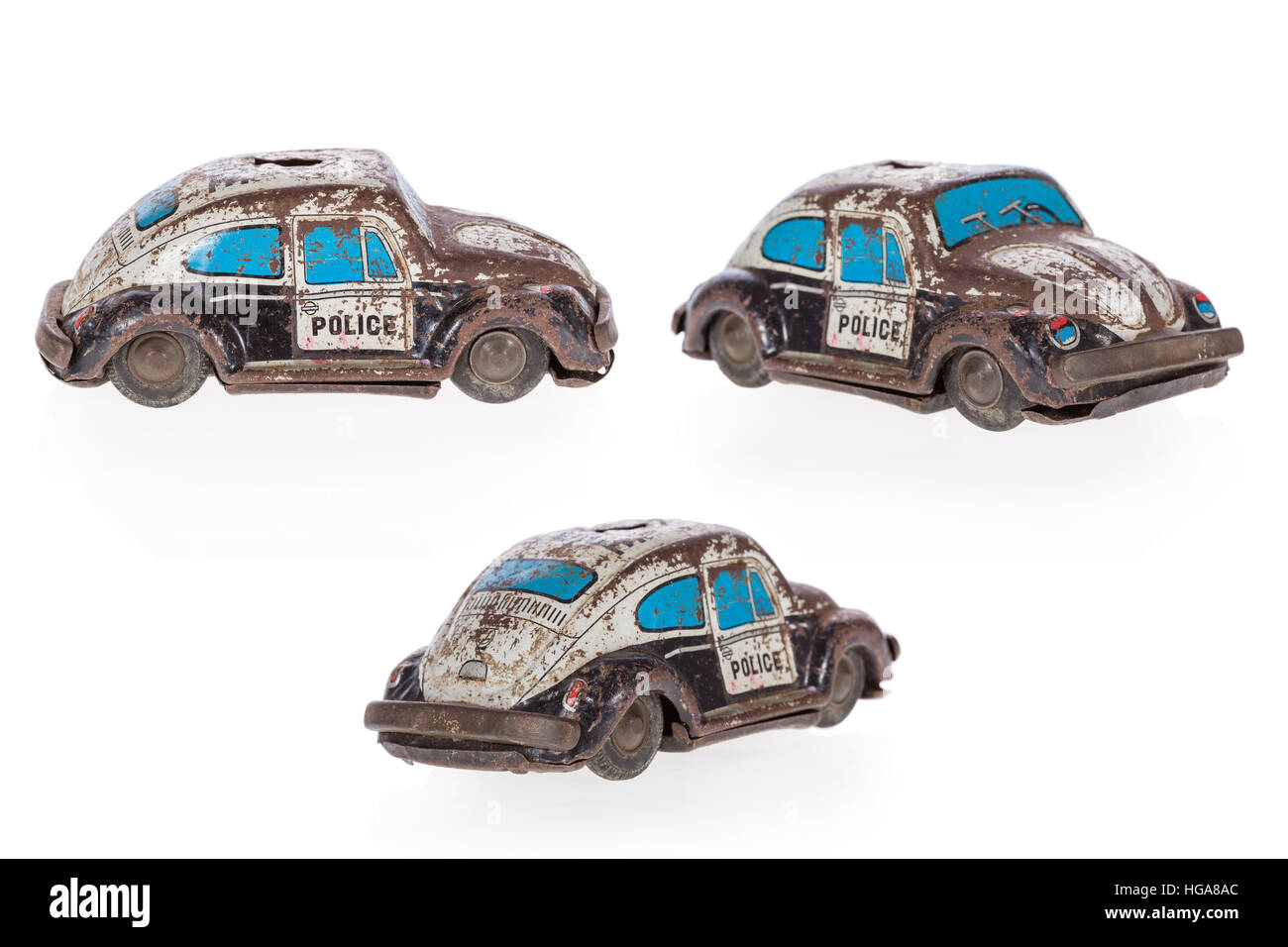 Old, rusty tin toy. Police car isolated on a white background Stock ...