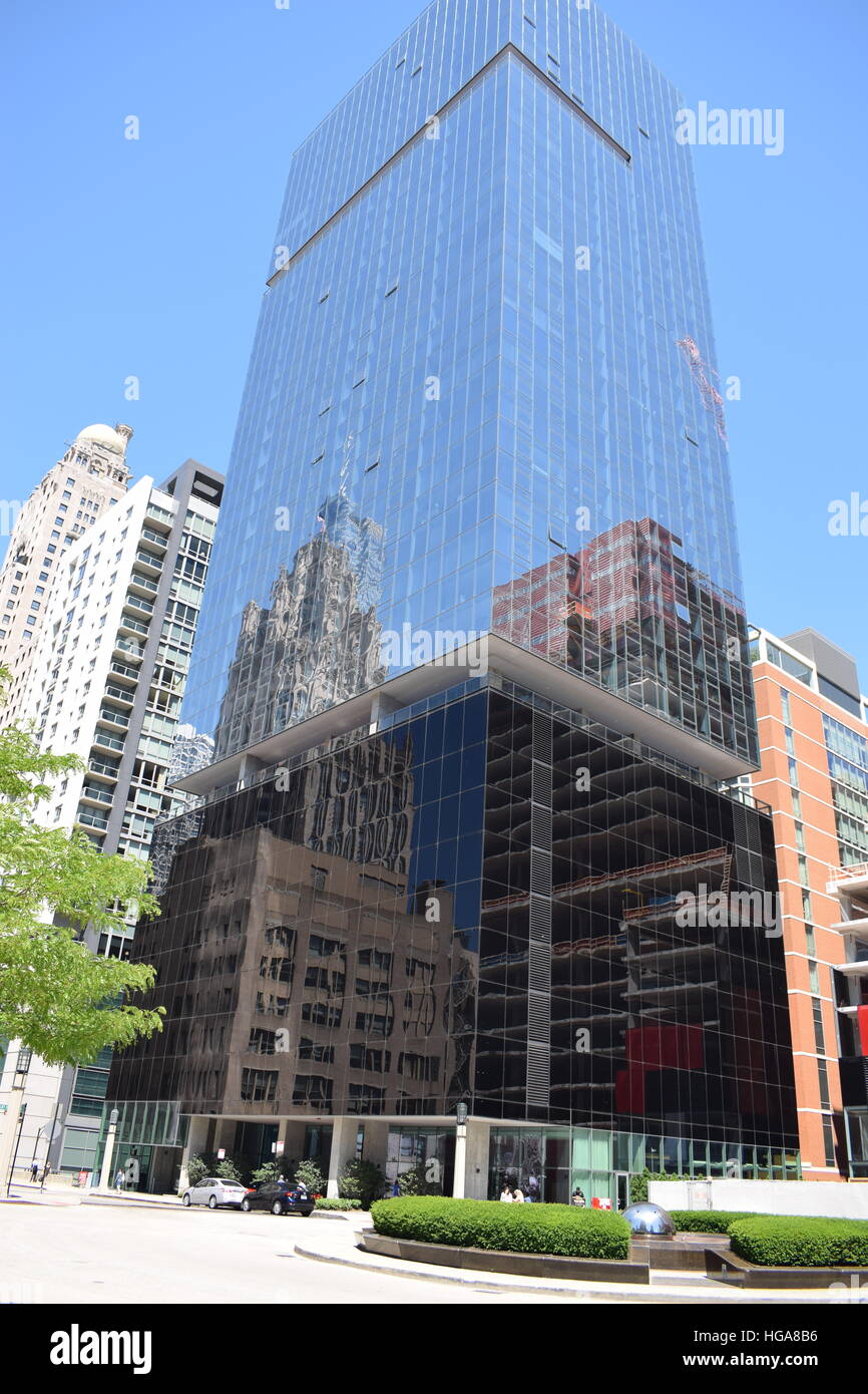 Glass building reflecting other building Stock Photo - Alamy