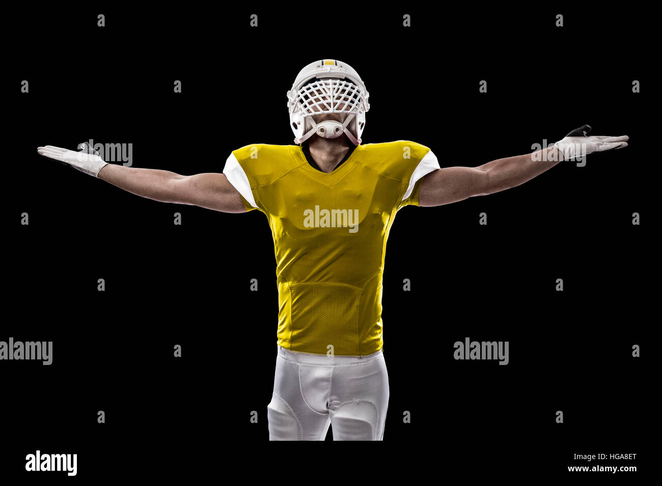 Football Player with a yellow uniform celebrating, on a black ...