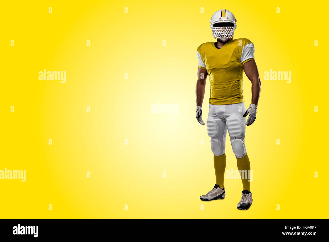 Football Player with a yellow uniform on a yellow background Stock ...