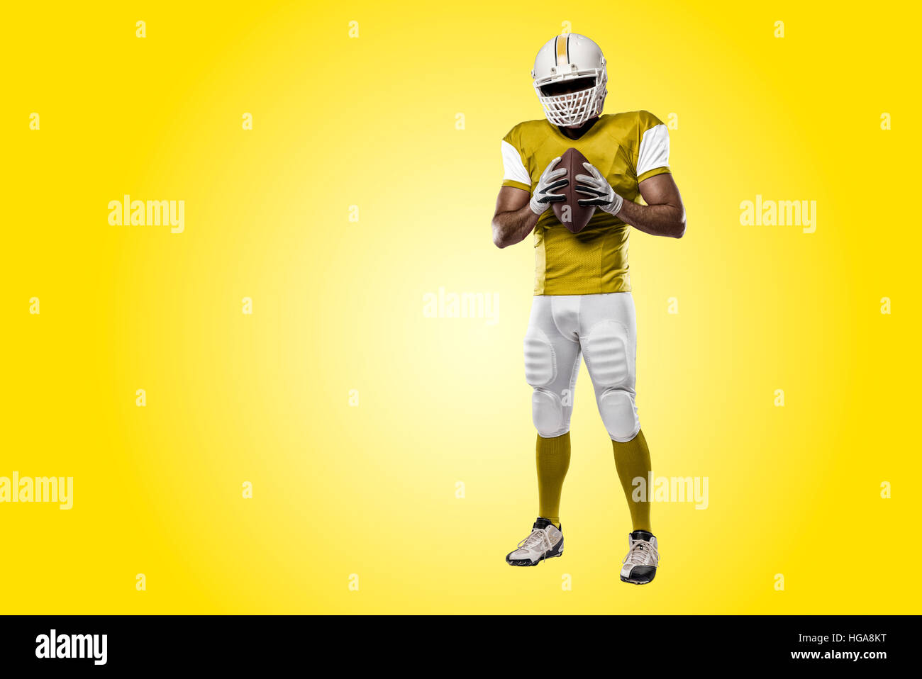 Football Player with a yellow uniform on a yellow background Stock ...