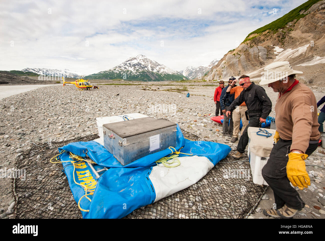 Rafters loading cargo net to be hauled by helicopter over the ...