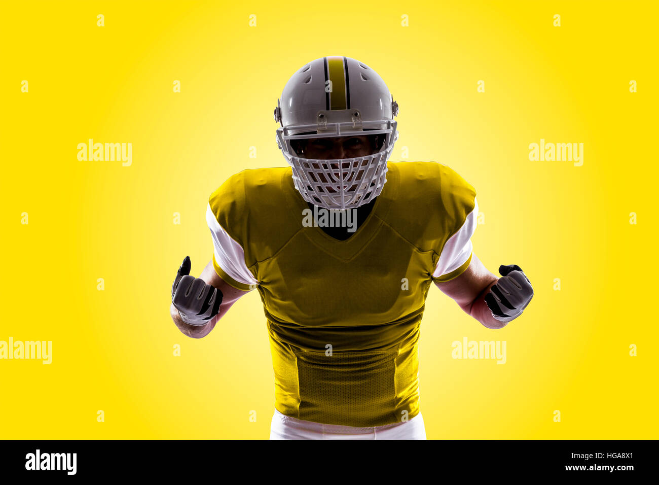 Football Player with a yellow uniform on a yellow background Stock ...