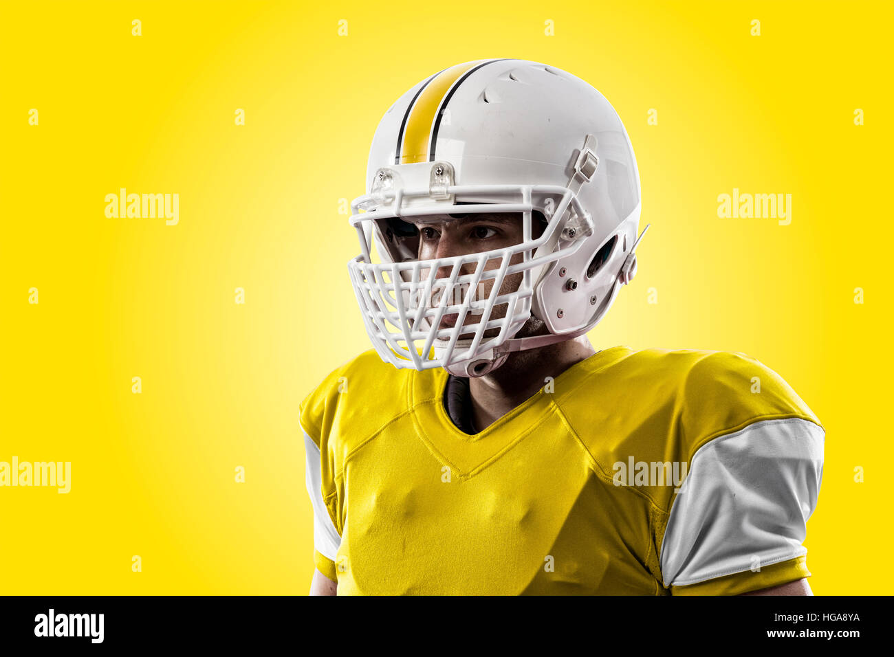 Close up of a Football Player with a yellow uniform on a yellow ...