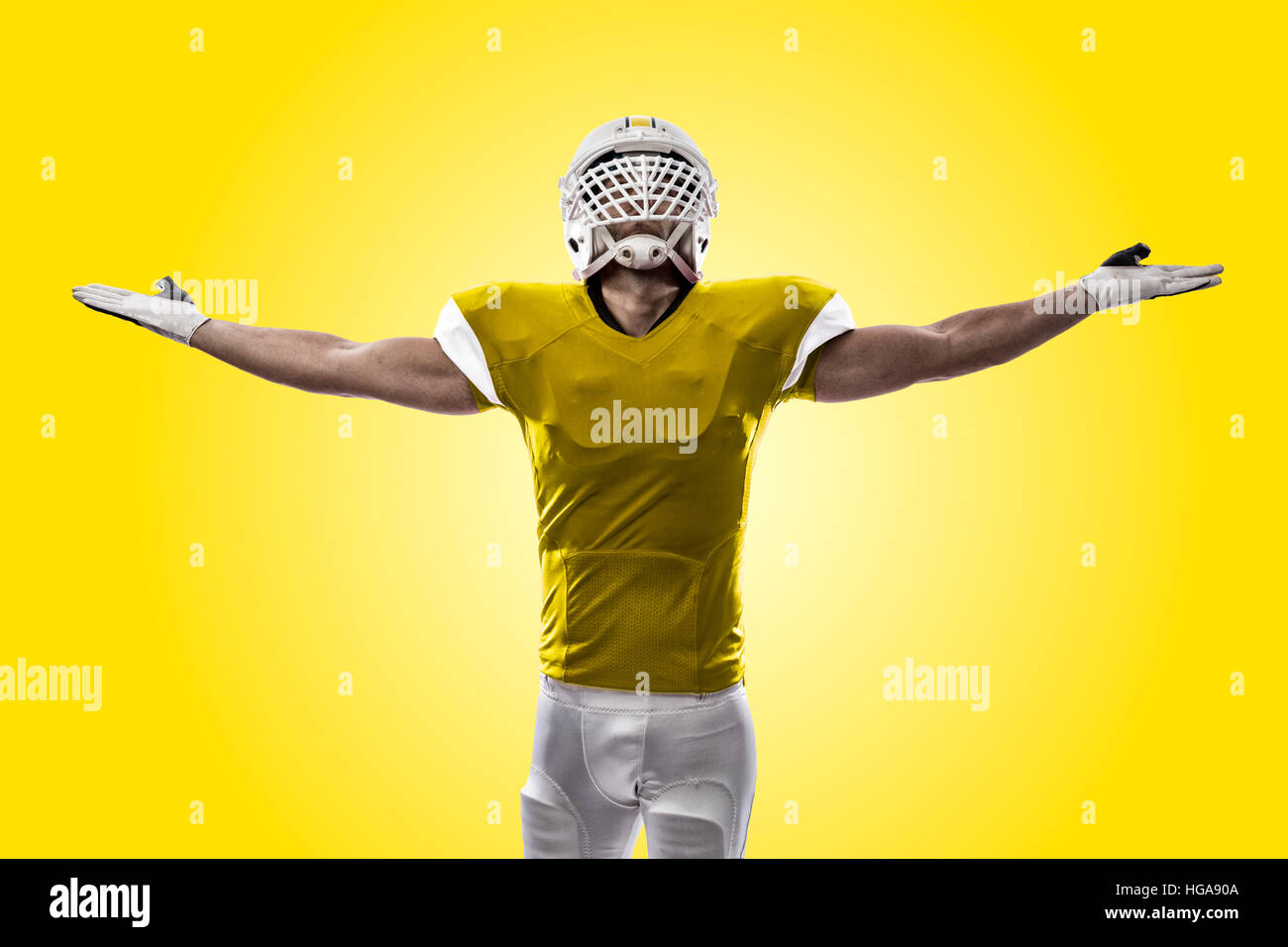 Football Player with a yellow uniform celebrating, on a yellow ...