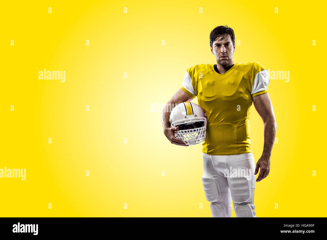 Football Player with a yellow uniform on a yellow background Stock ...