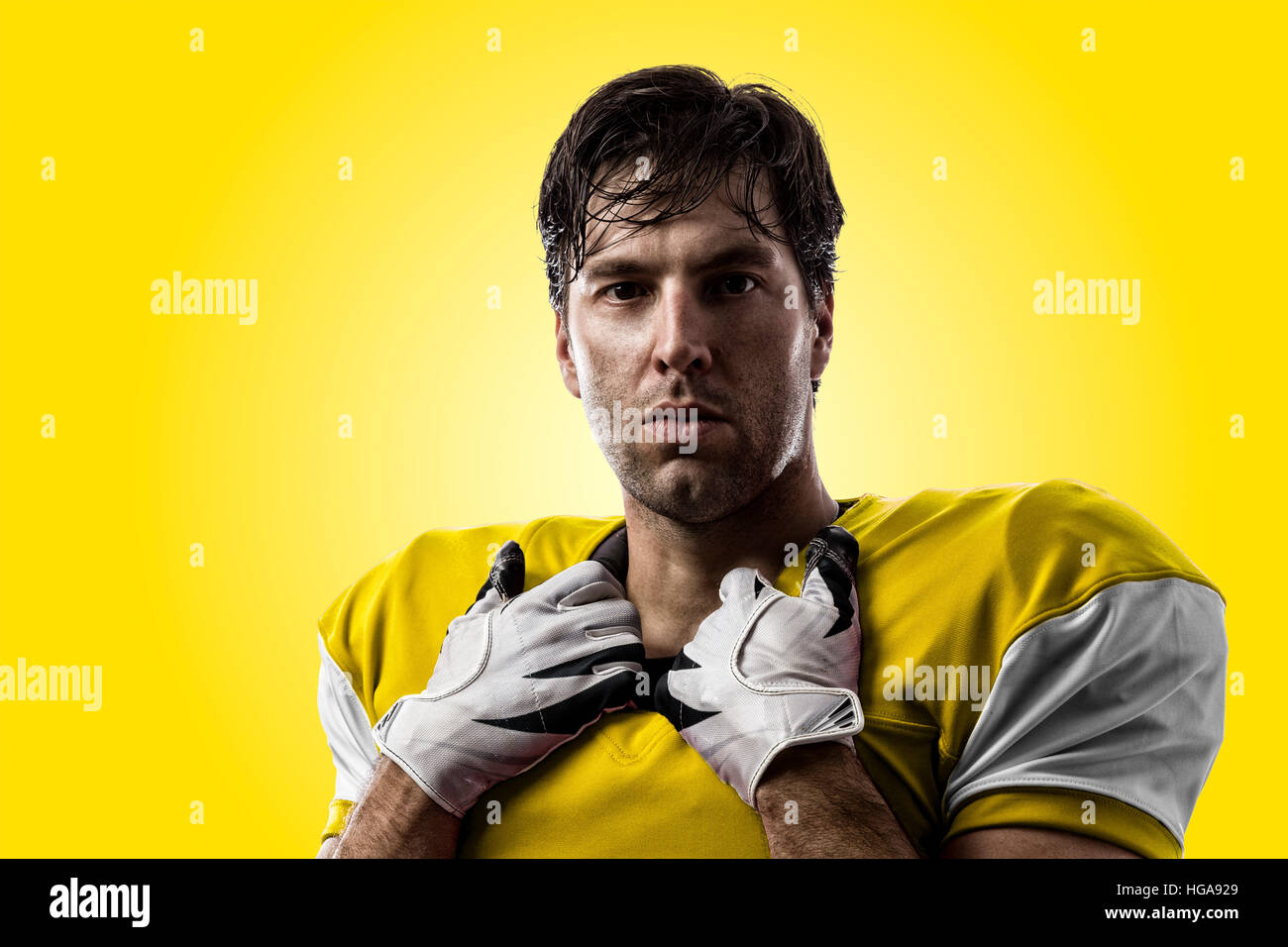 Football Player with a yellow uniform on a yellow background Stock ...