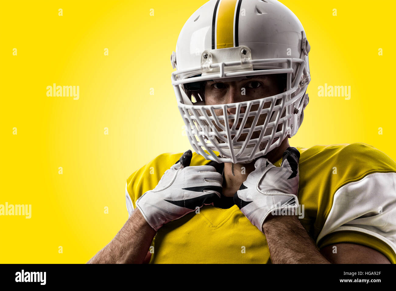 Football Player with a yellow uniform on a yellow background Stock ...