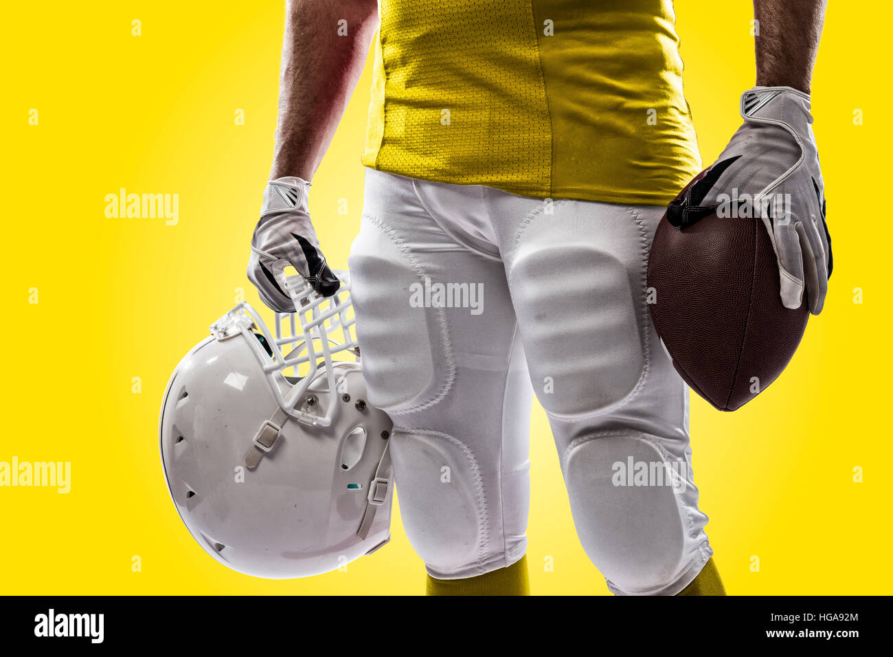 Football Player with a yellow uniform on a yellow background Stock ...