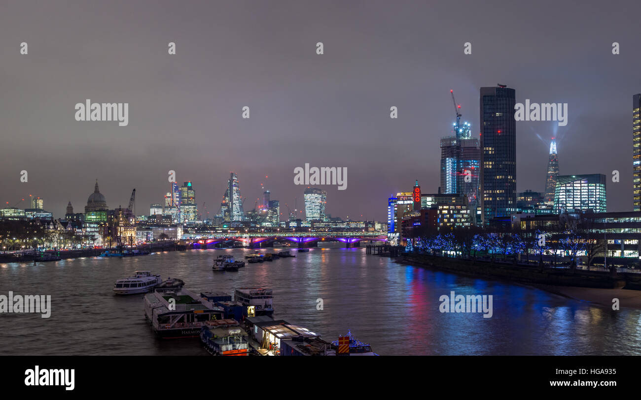 London skyline panorama at night with light streaks and light show as ...