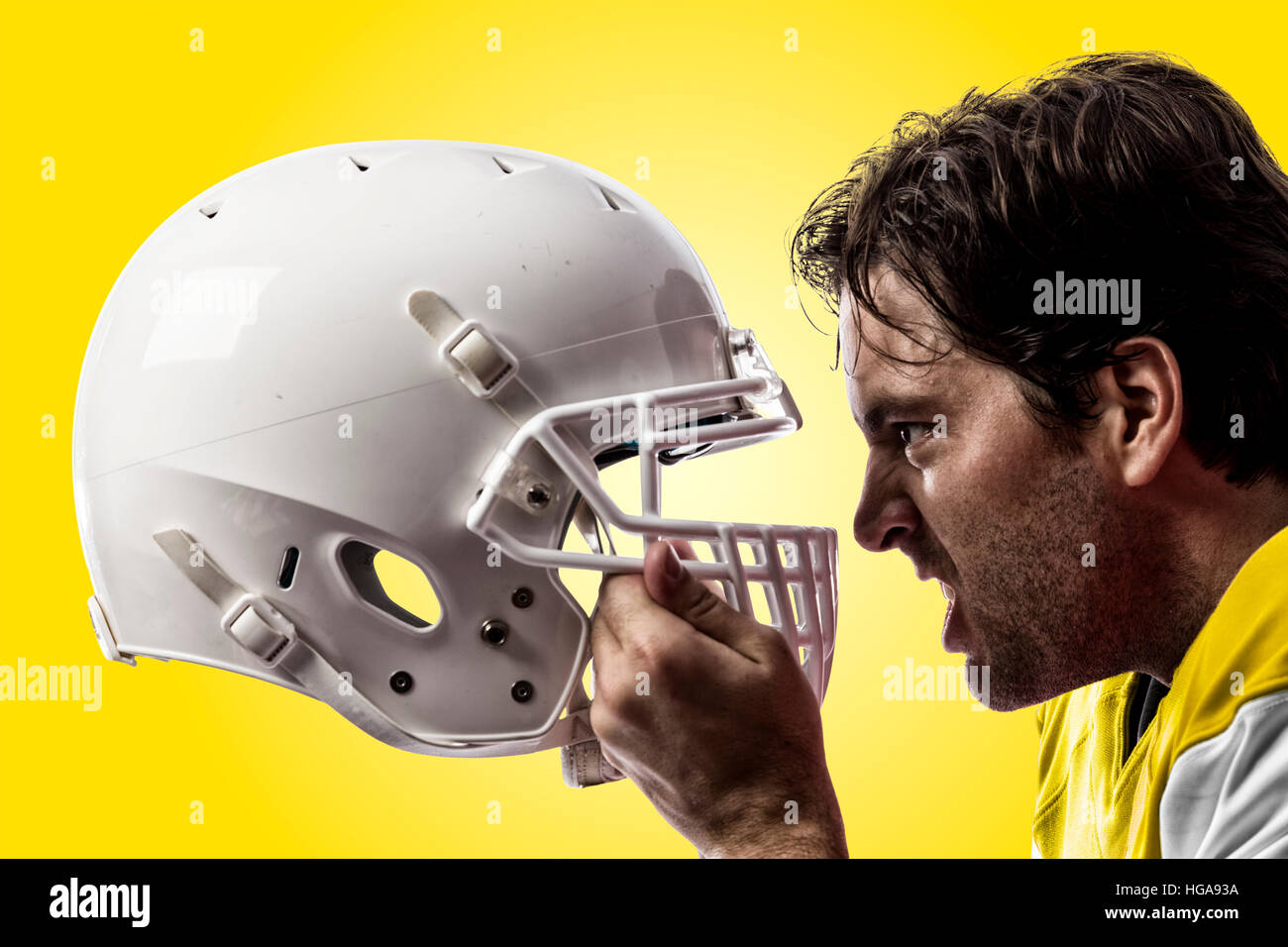 Close up of a Football Player with a yellow uniform on a yellow ...