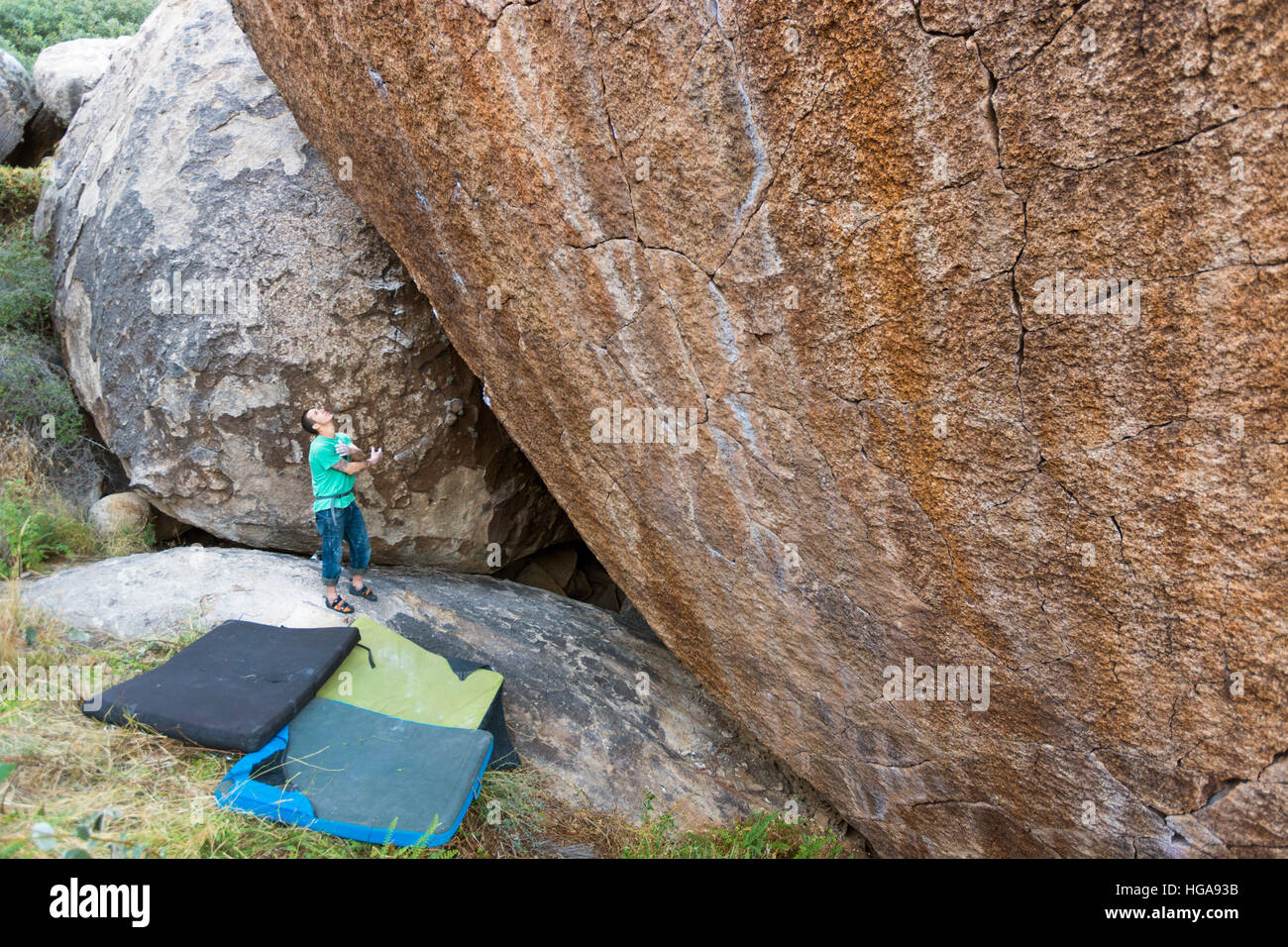 Male climber scanning a boulder problem in PeÃ±oles, Chihuahua Stock ...
