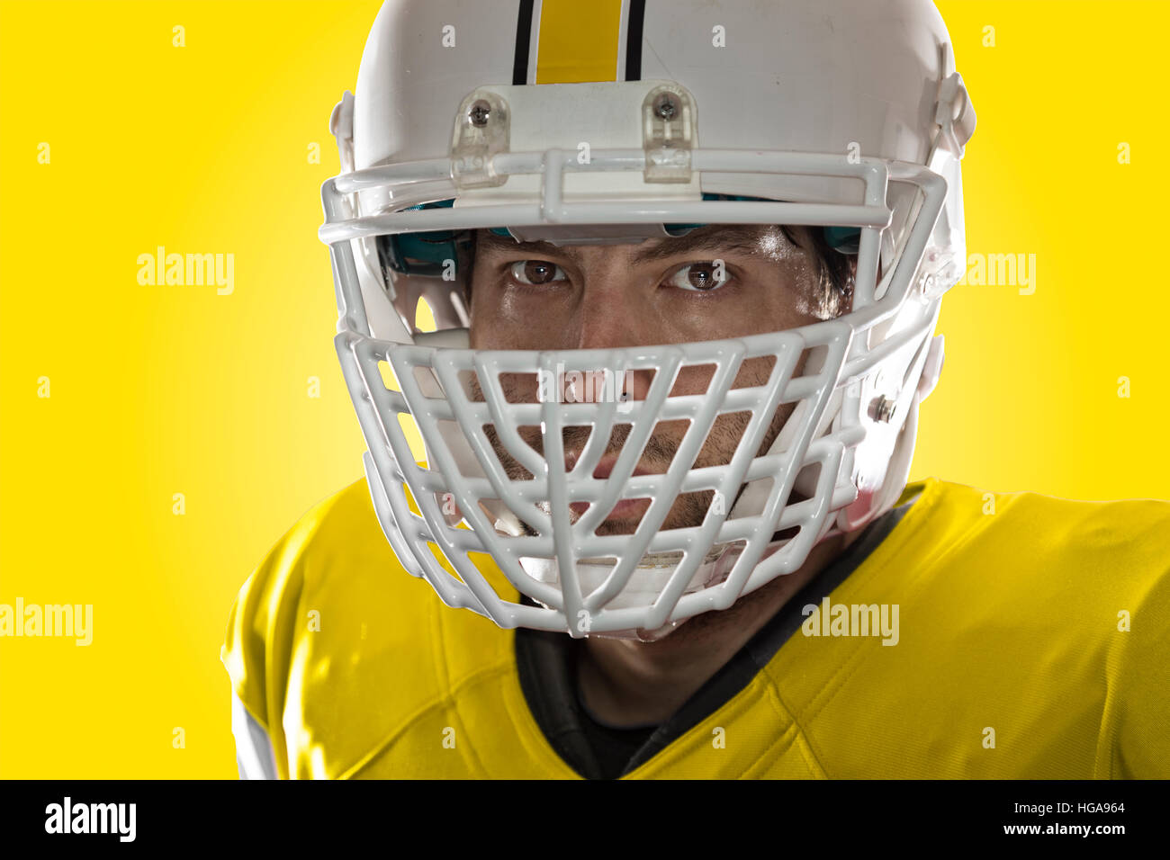 Close up in the eyes of a Football Player with a yellow uniform on a ...