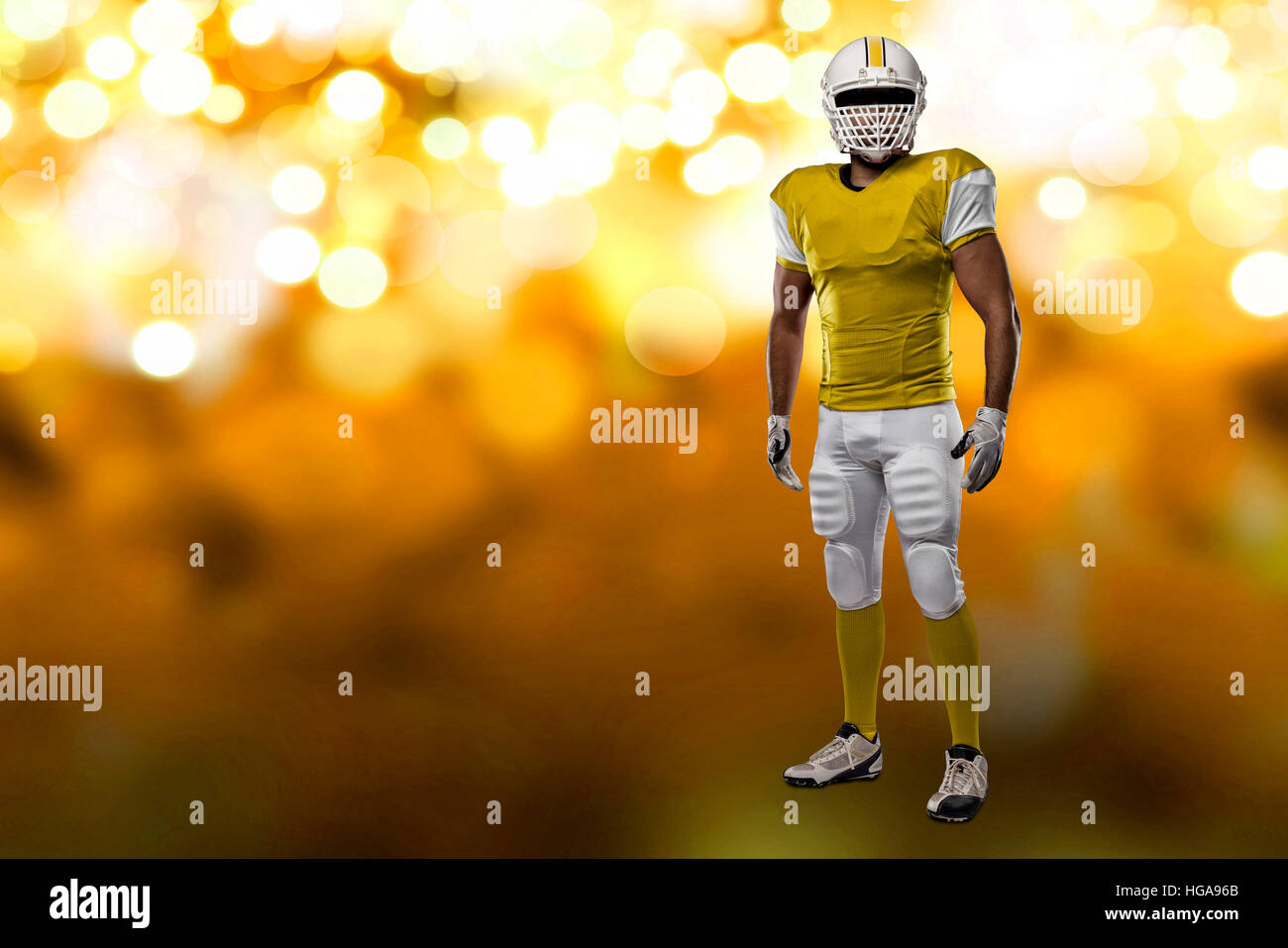 Football Player with a yellow uniform on a yellow lights background ...
