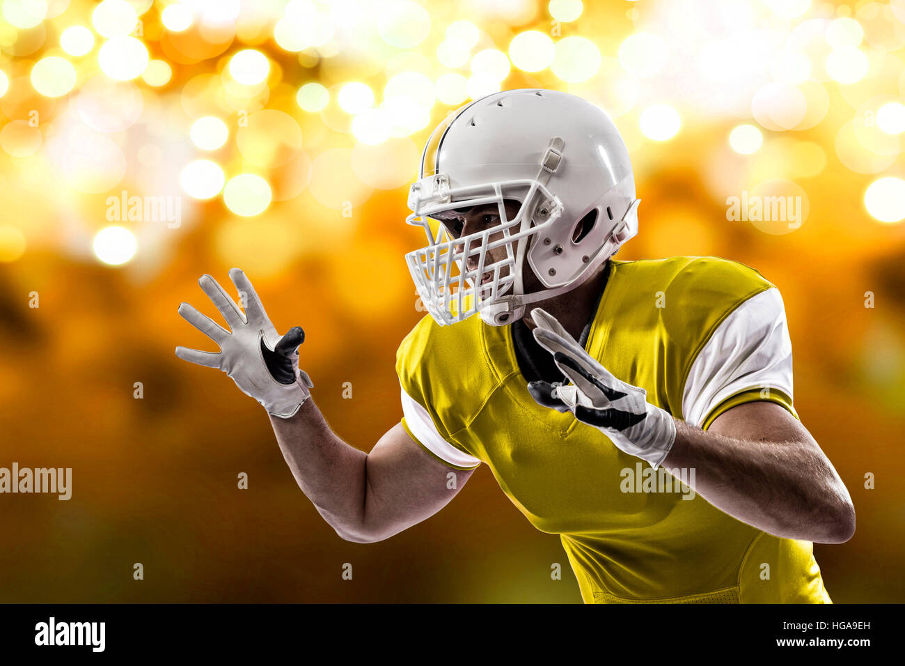 Football Player with a yellow uniform making a tackle on a yellow ...
