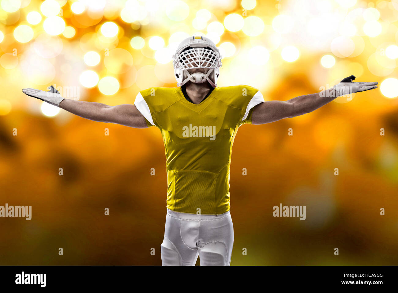 Football Player with a yellow uniform celebrating, on a yellow lights ...