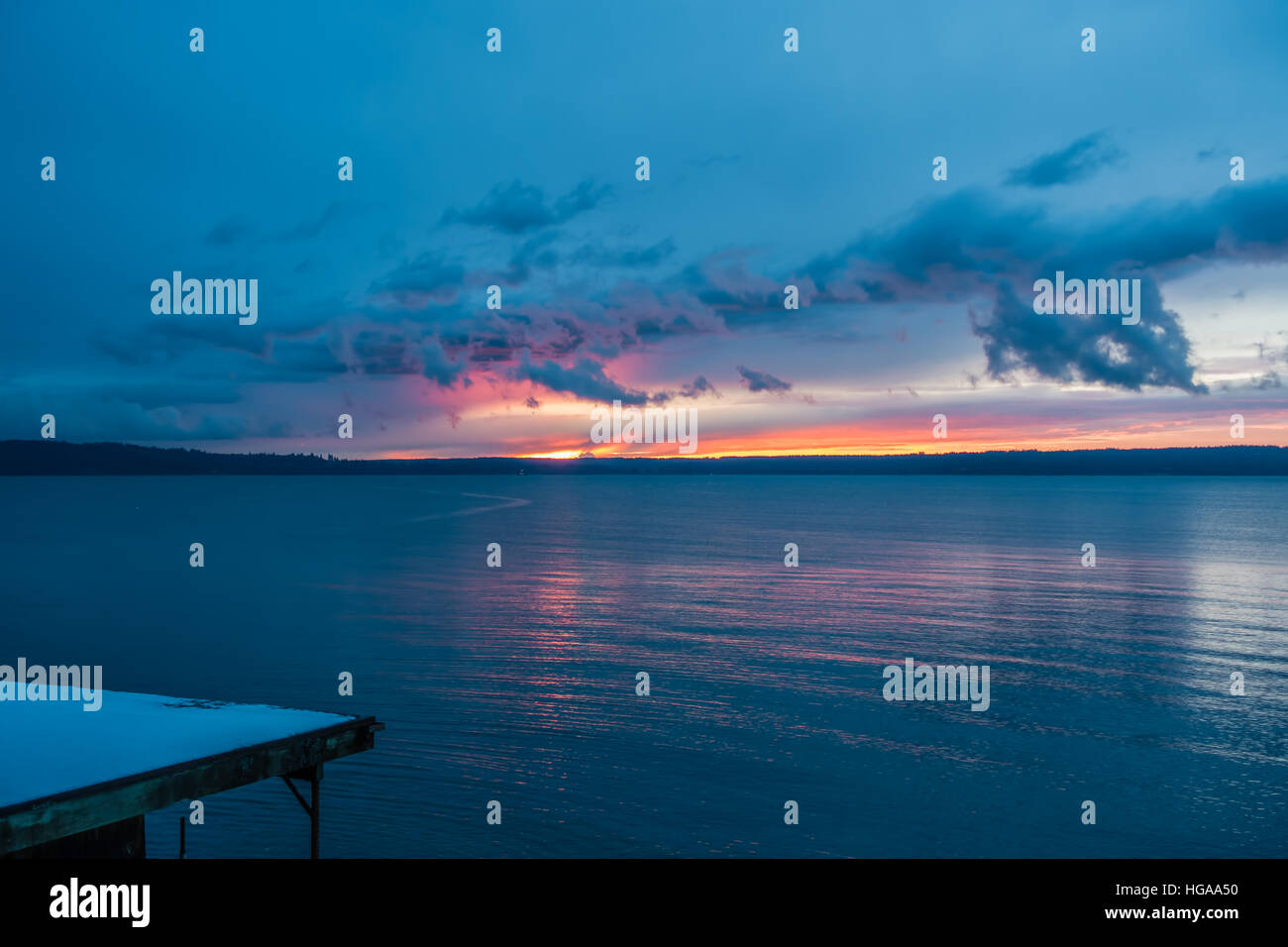 The sun sets behind the Puget Sound in winter Stock Photo - Alamy
