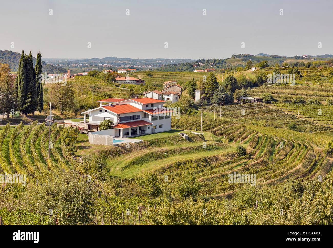 Rural mediterranean landscape with village, vineyards and mountains ...