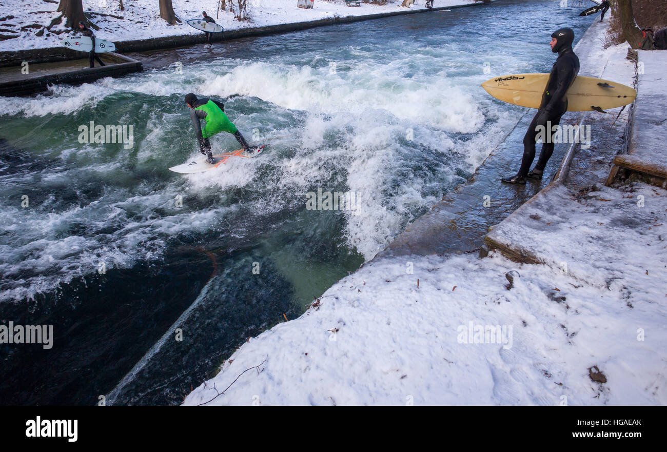 Munich, Germany. 06th Jan, 2017. Surfers make use of a standing wave in ...