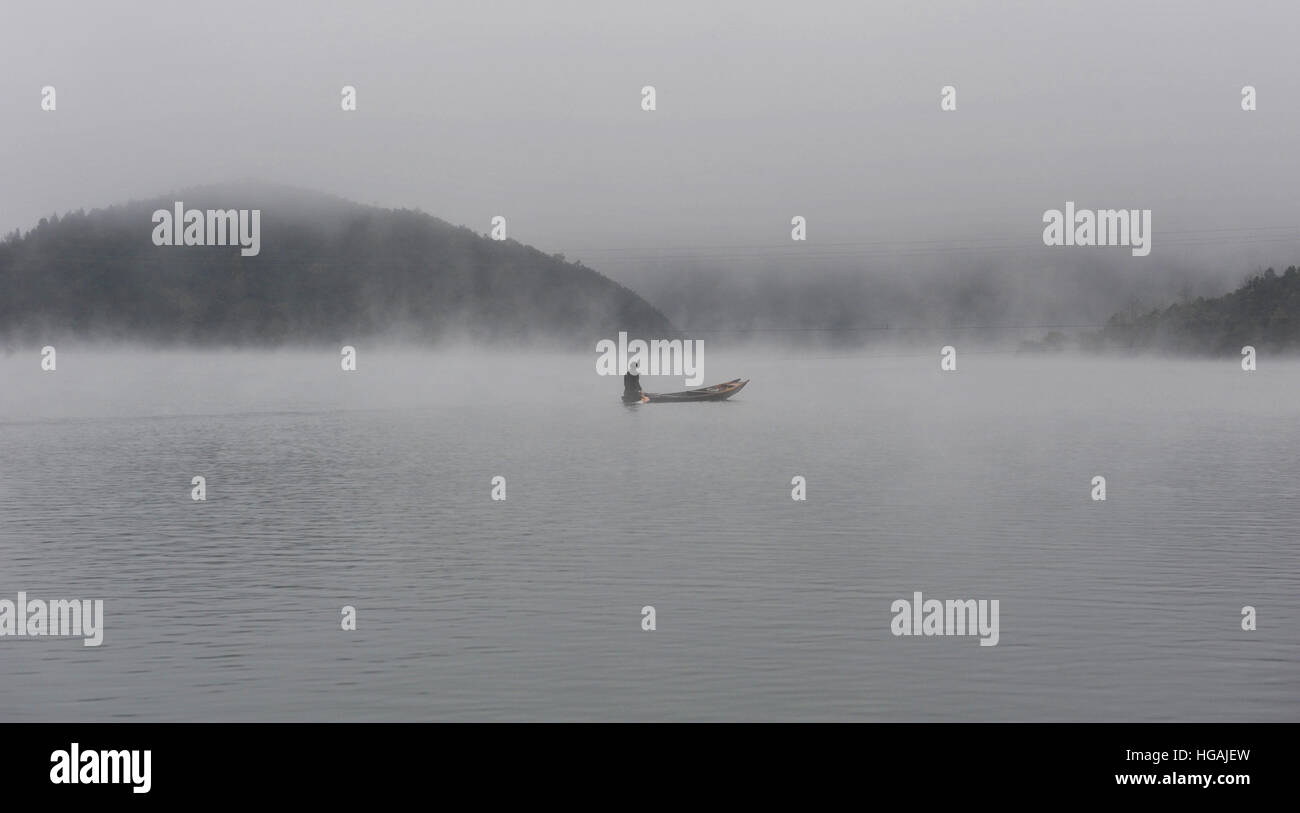 Hangzhou, Hangzhou, China. 7th Jan, 2017. A fishermen fish in Liuxi ...