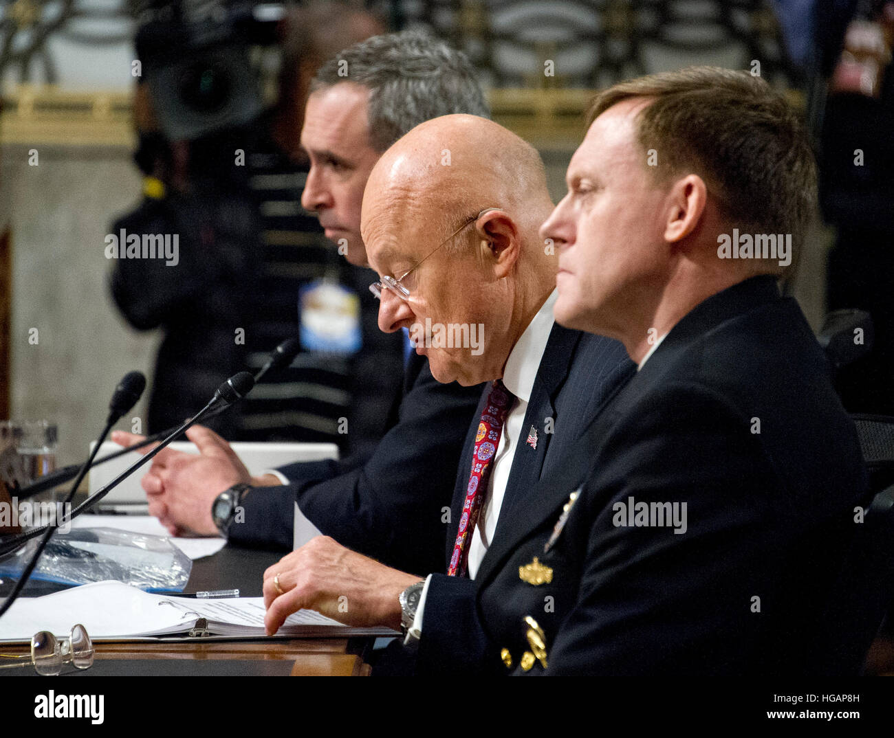 James R. Clapper, Jr., Director Of National Intelligence, center, makes ...