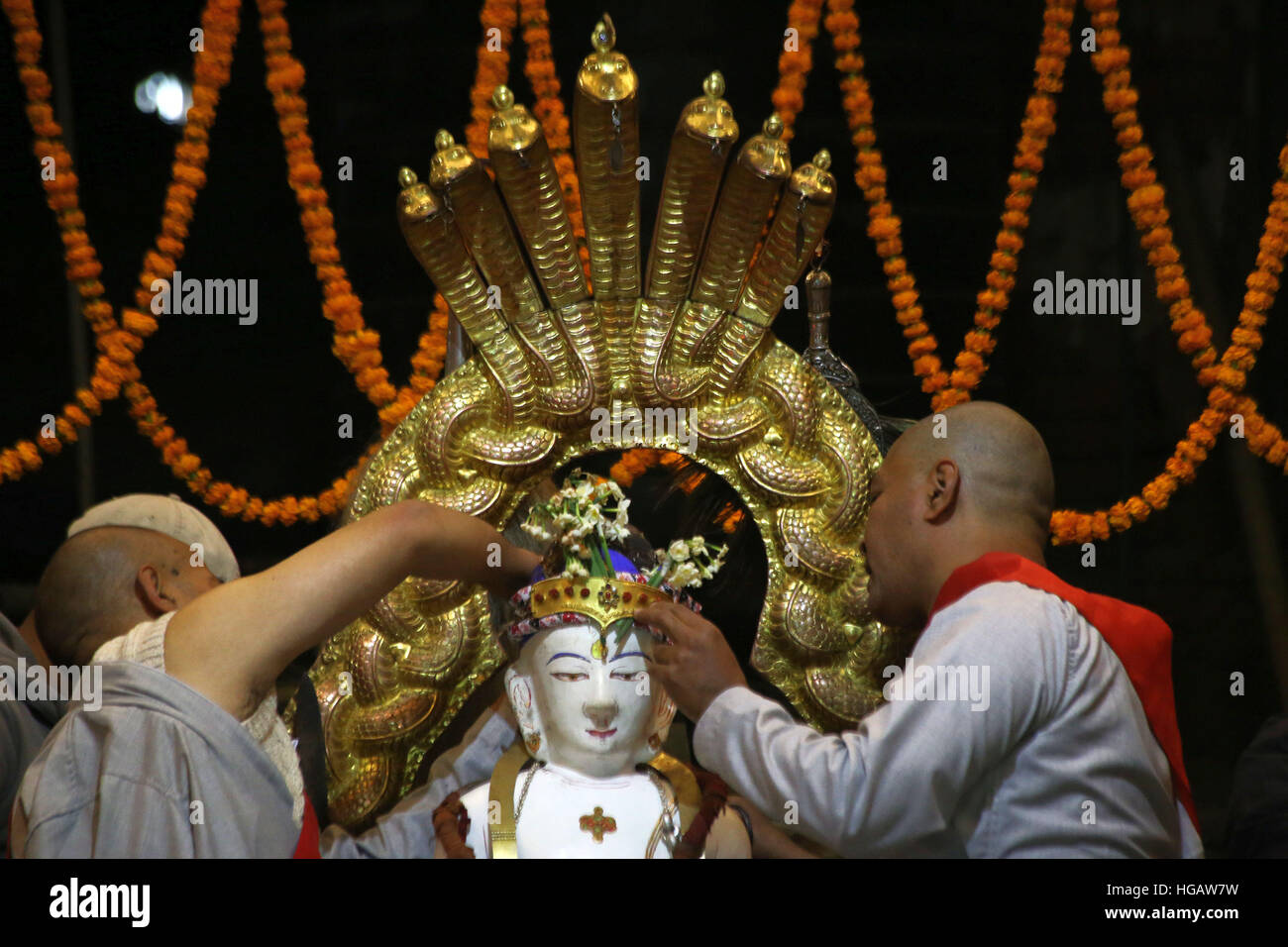 Kathmandu, Nepal. 06th Jan, 2017. Priests arrange the crown of the Lord ...