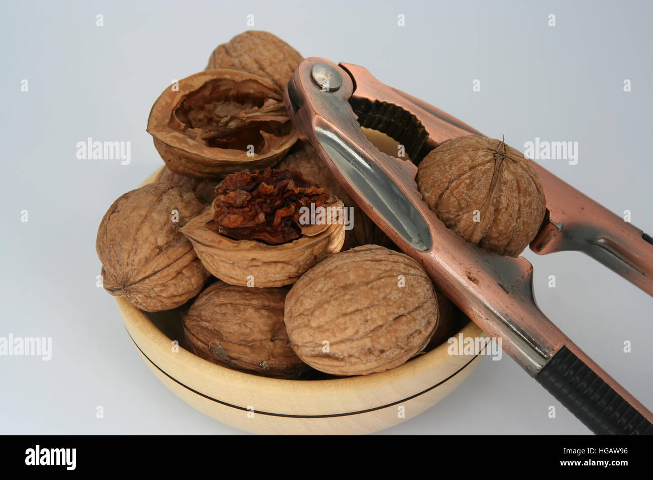 Nutcracker and a walnuts. Cracking the walnuts Stock Photo - Alamy