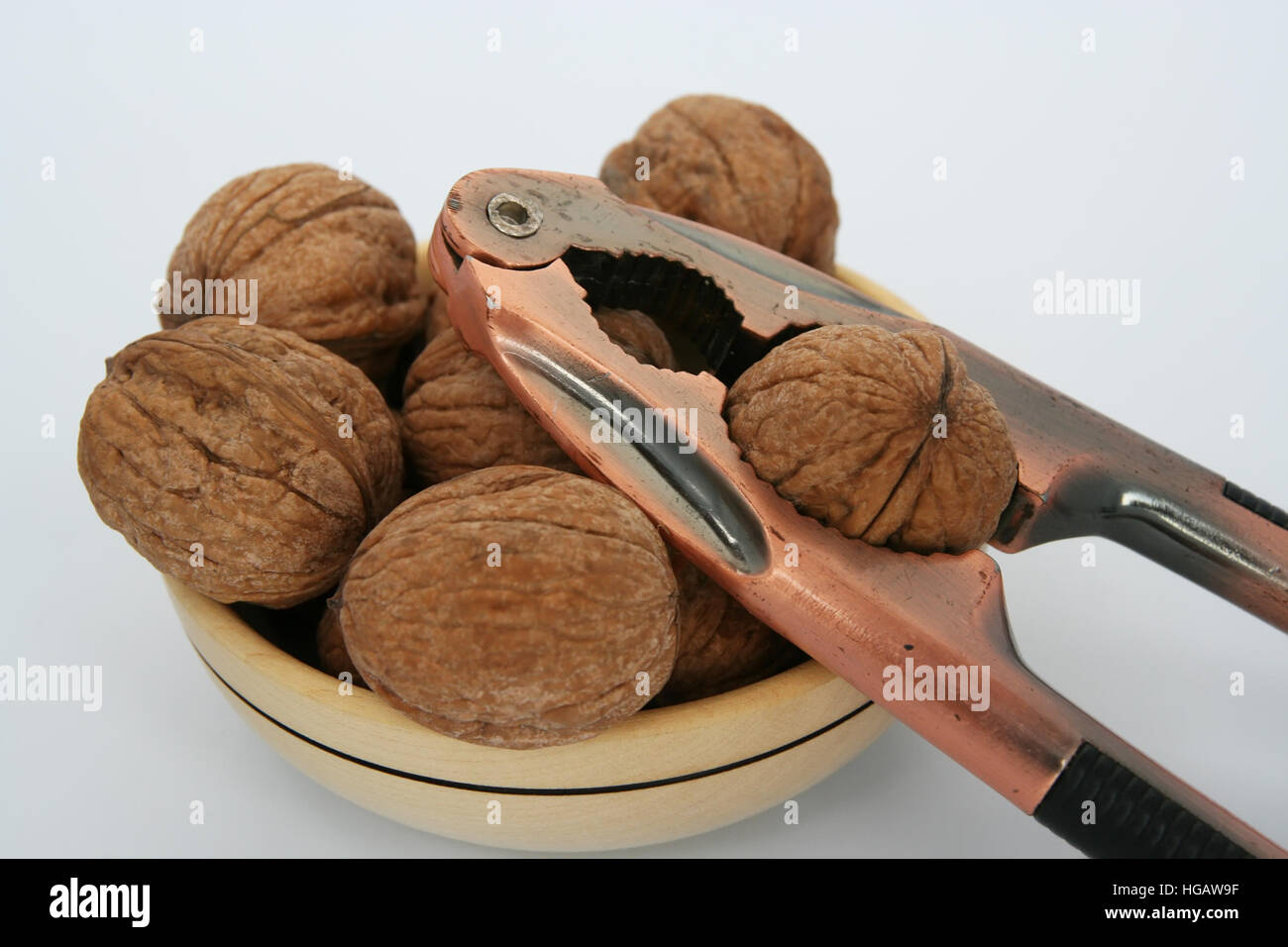Nutcracker and a walnuts. Cracking the walnuts Stock Photo - Alamy