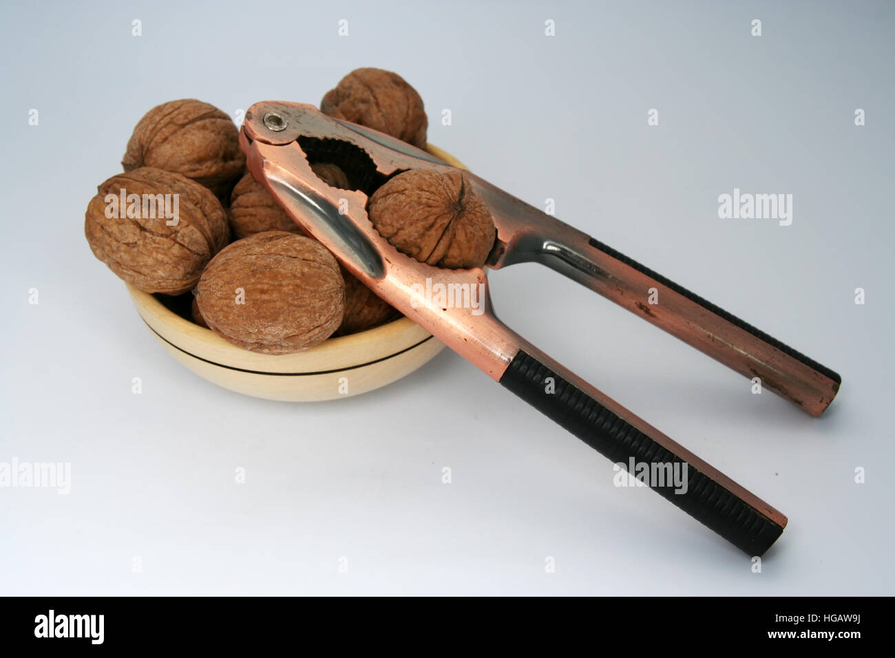 Nutcracker and a walnuts. Cracking the walnuts Stock Photo - Alamy