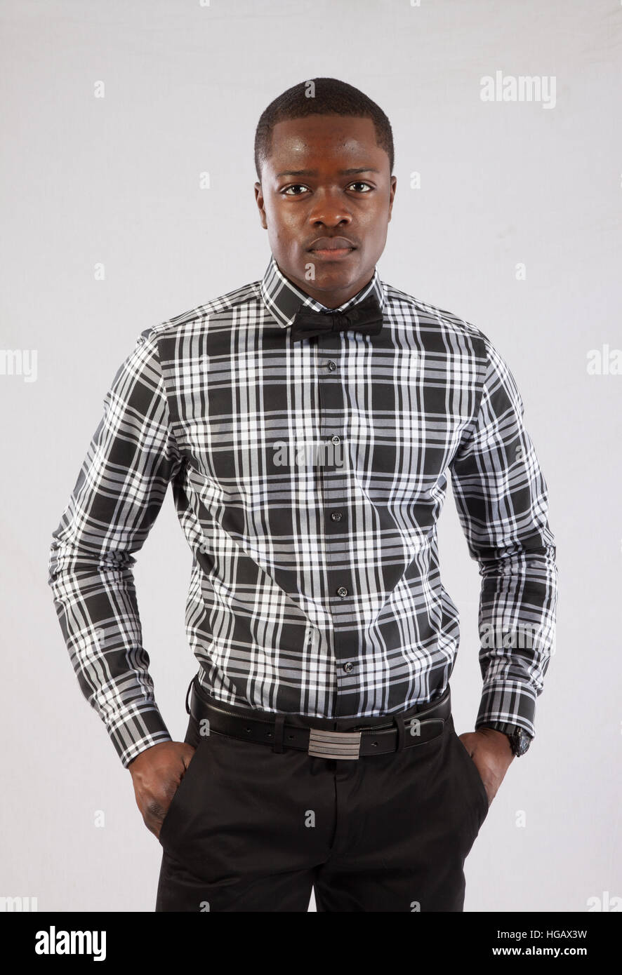 Handsome black man in bow tie, looking thoughtful Stock Photo - Alamy