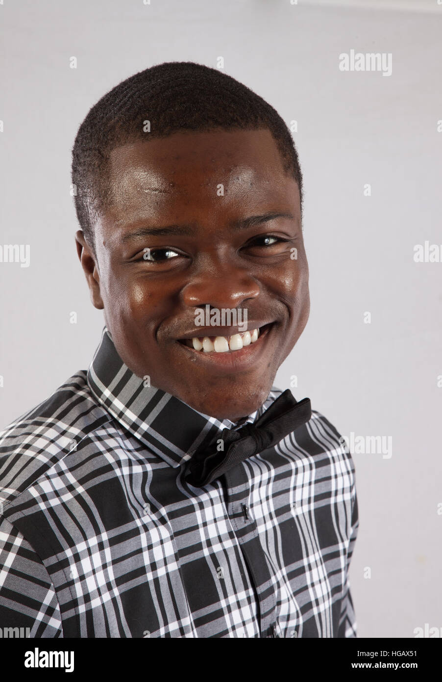 Handsome black man in bow tie, smiling broadly Stock Photo - Alamy