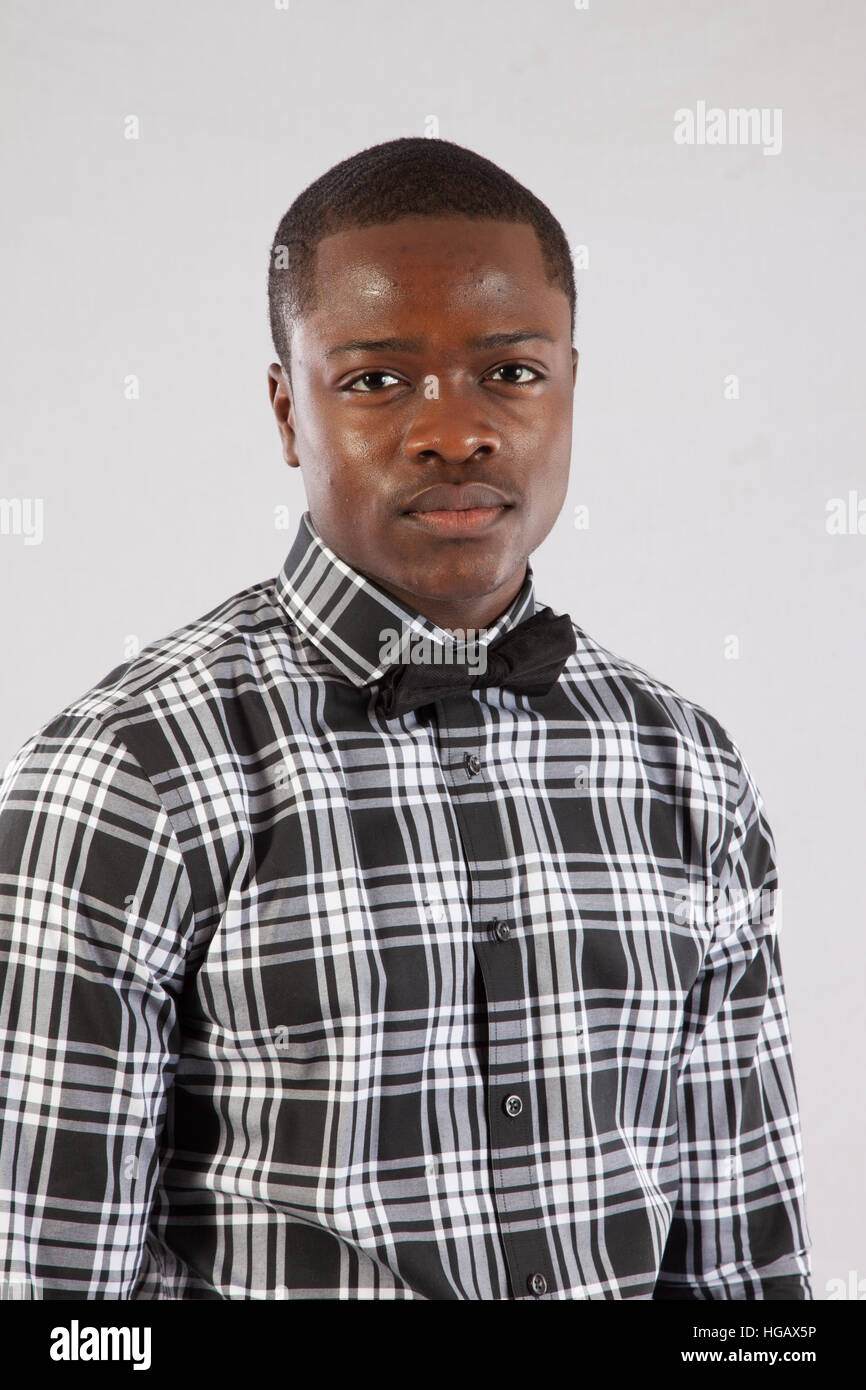 Handsome black man in bow tie, looking thoughtful Stock Photo - Alamy