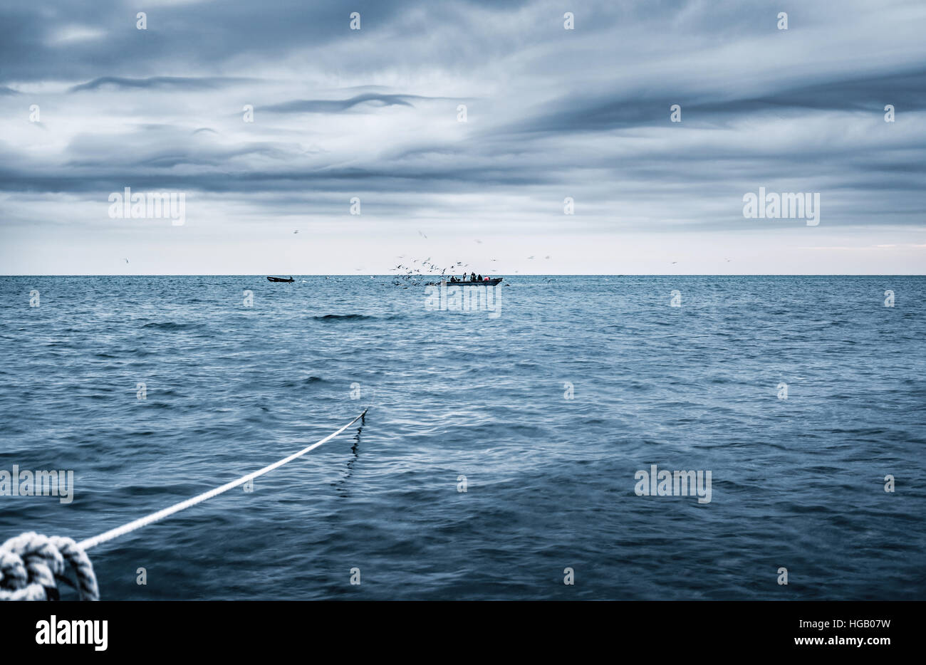 fishermen check the entangling net Stock Photo - Alamy