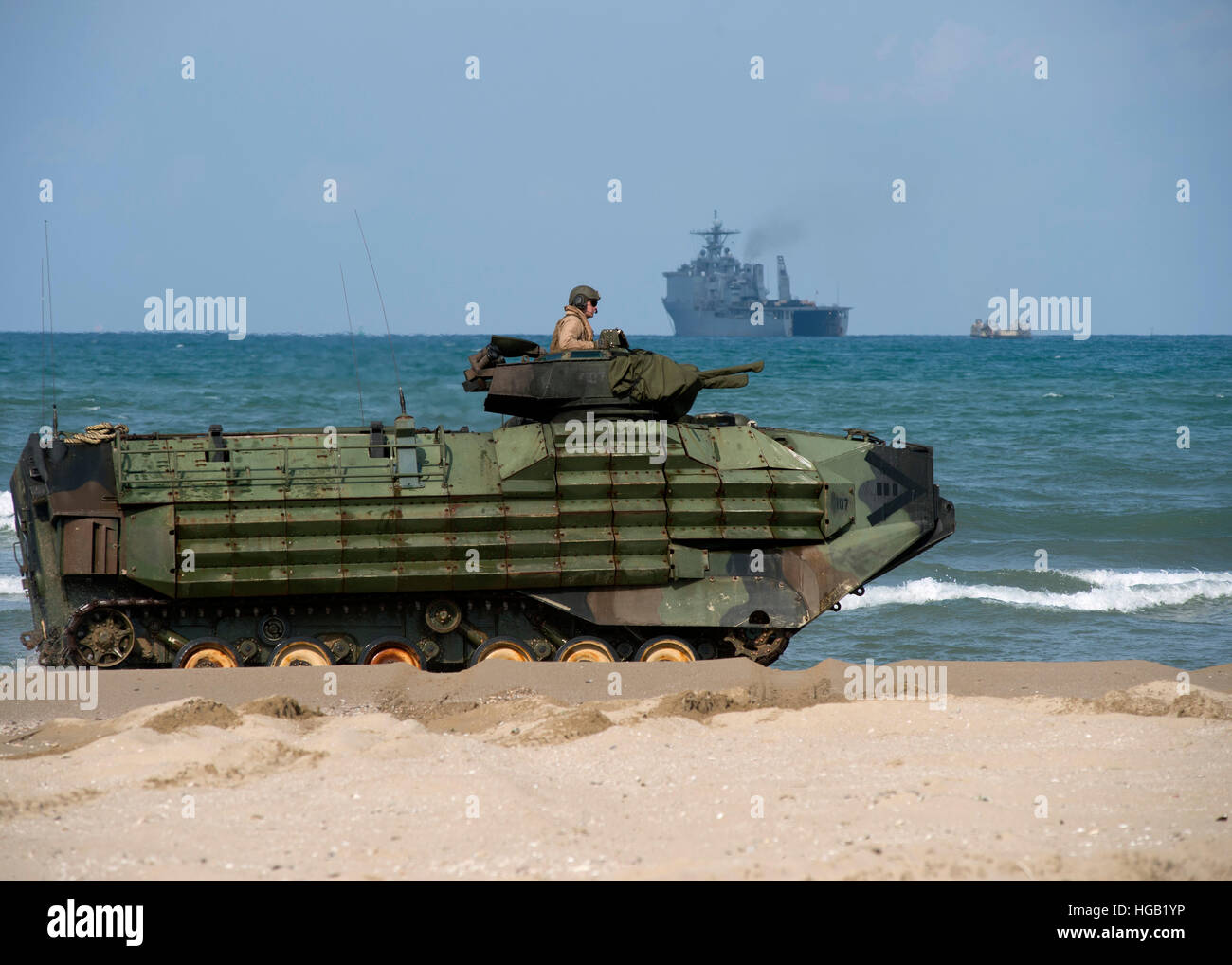 An U.S. Marine Corps amphibious assault vehicle arrives on shore in ...