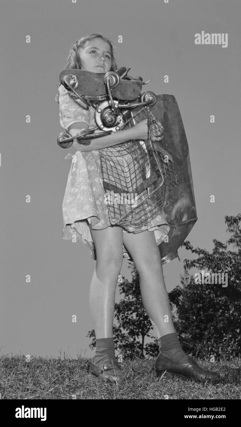 A young girl collects scrap for America's war industries, 1942 Stock ...