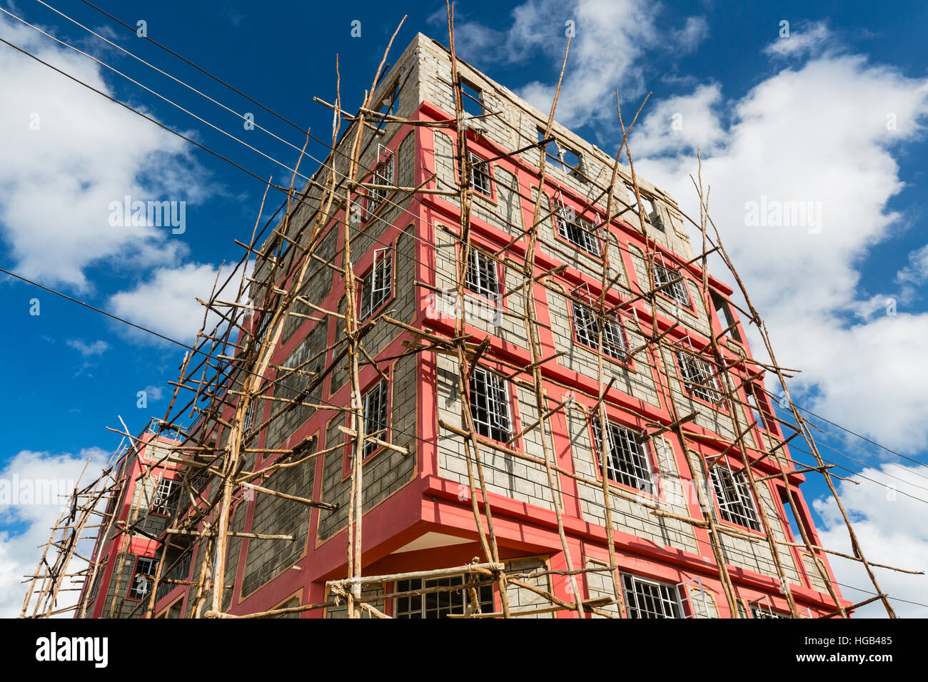 A small appartment building under construction with typical local ...