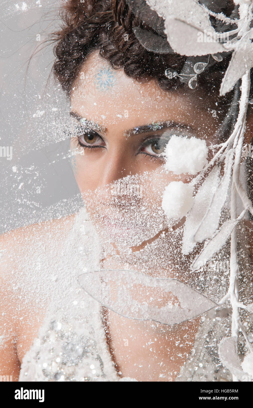 Woman looking out of a frosted window Stock Photo - Alamy