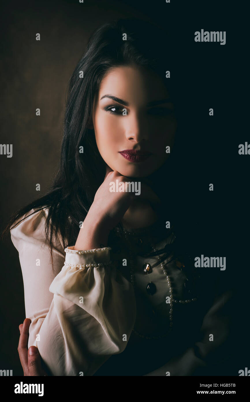 Beautiful woman in the dark Stock Photo - Alamy