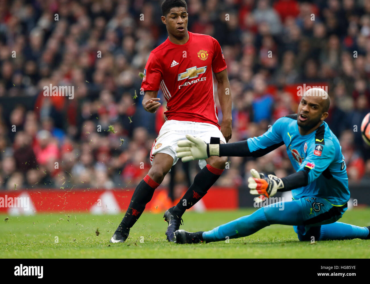 Manchester United's Marcus Rashford scores his side's third goal of the ...