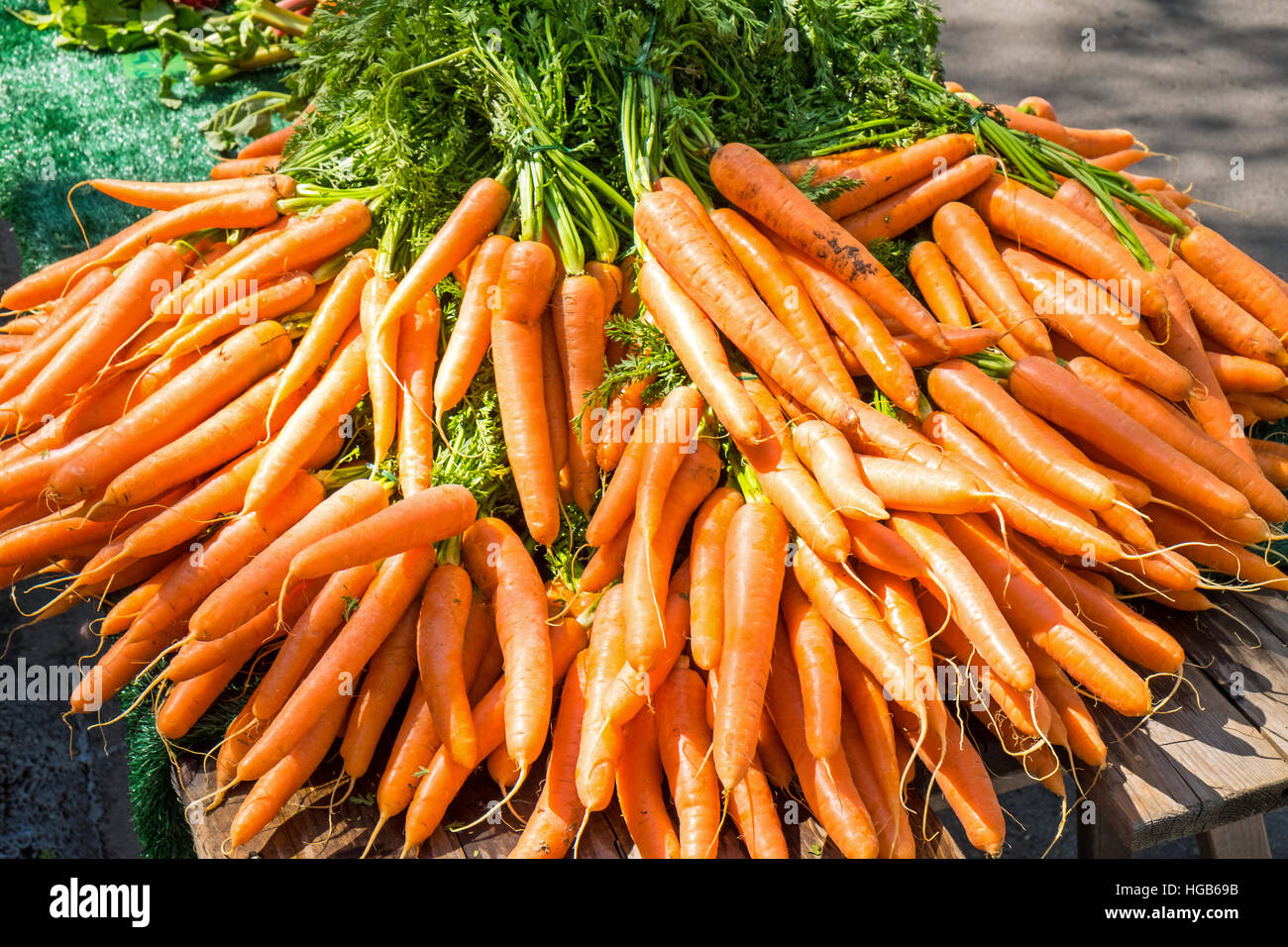 A bunch of carrots for sale at a market Stock Photo - Alamy